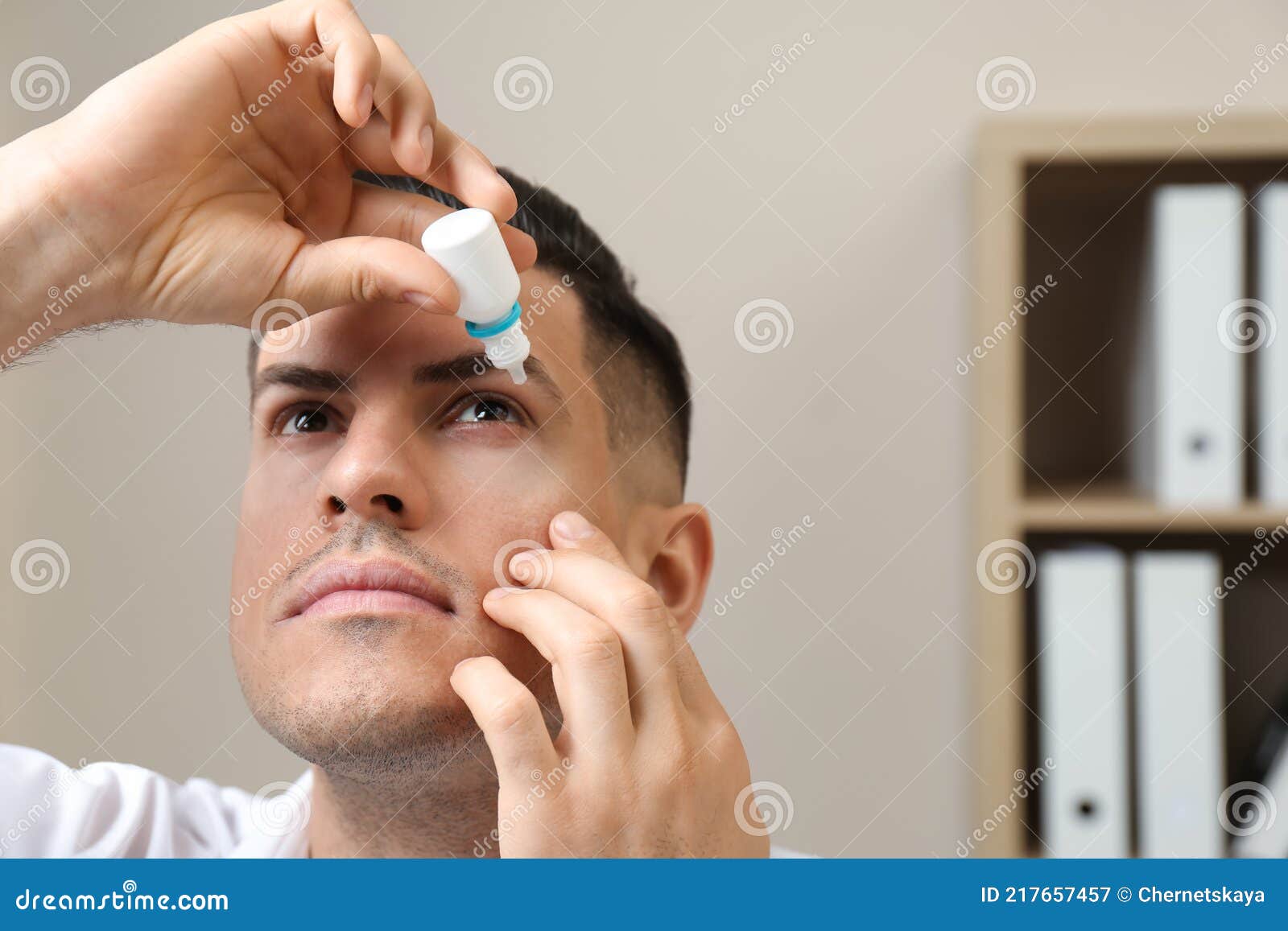 Man Using Eye Drops in Light Office Stock Image - Image of drops, copy ...