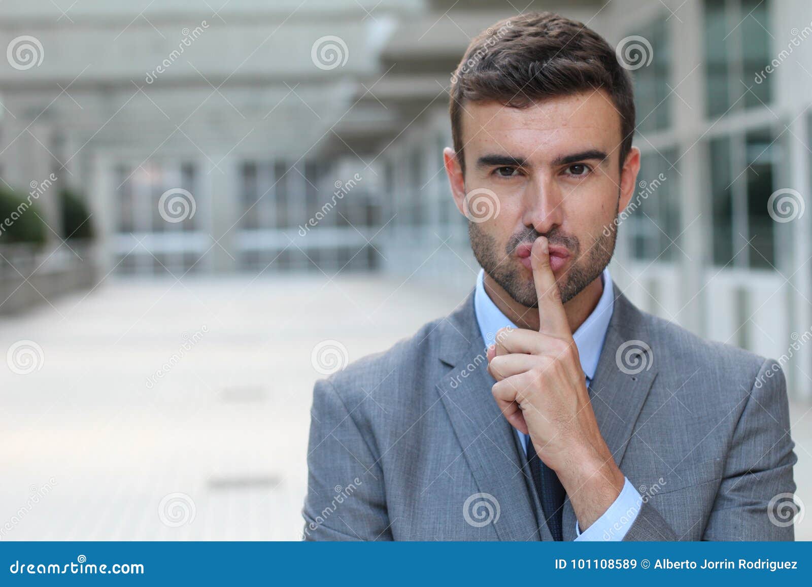 Man Using a Finger Sign To Request Someone To Remain Silent Stock Image ...