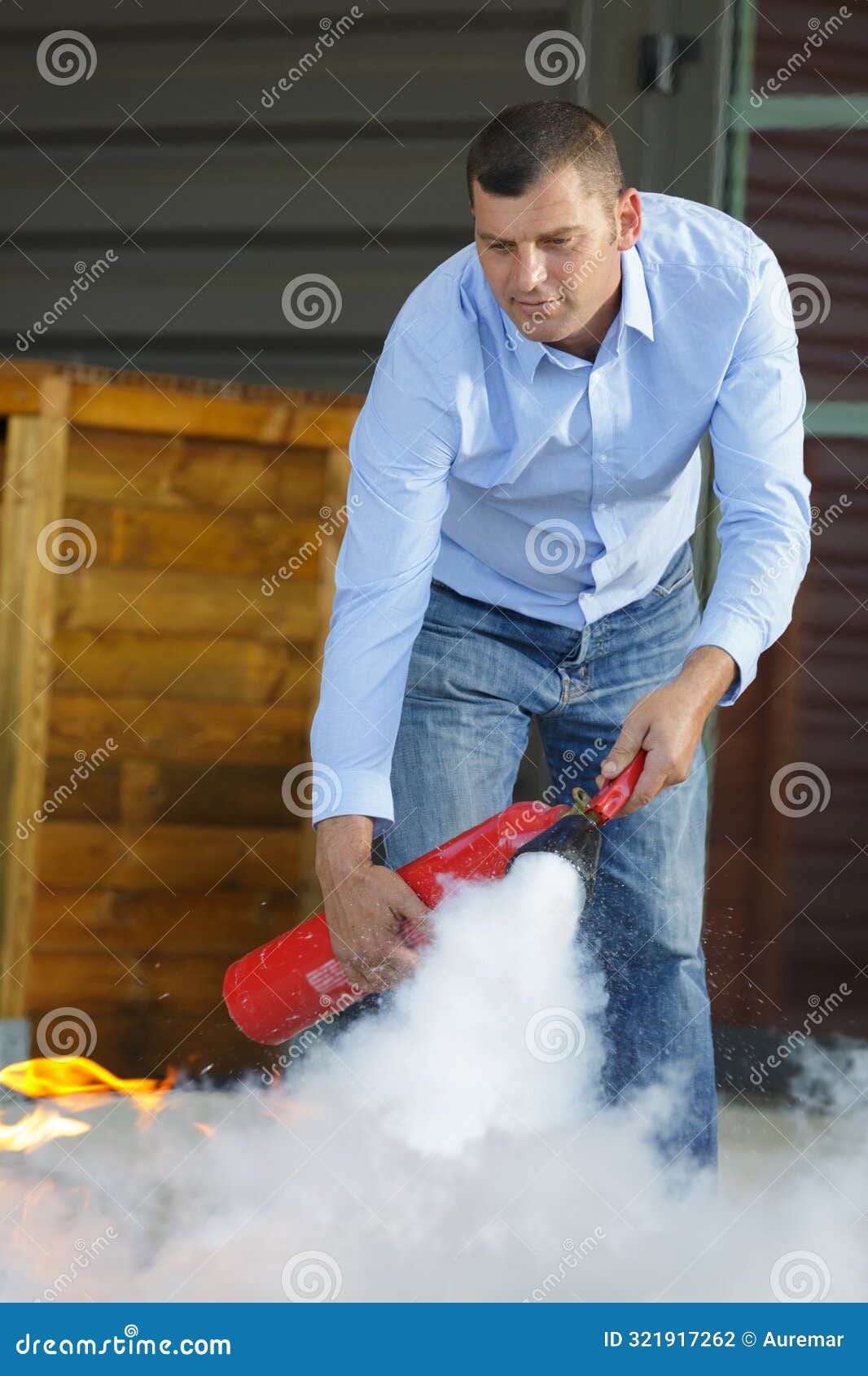 Man Using Fire Extinguisher Stock Photo - Image of emergency, apparatus ...