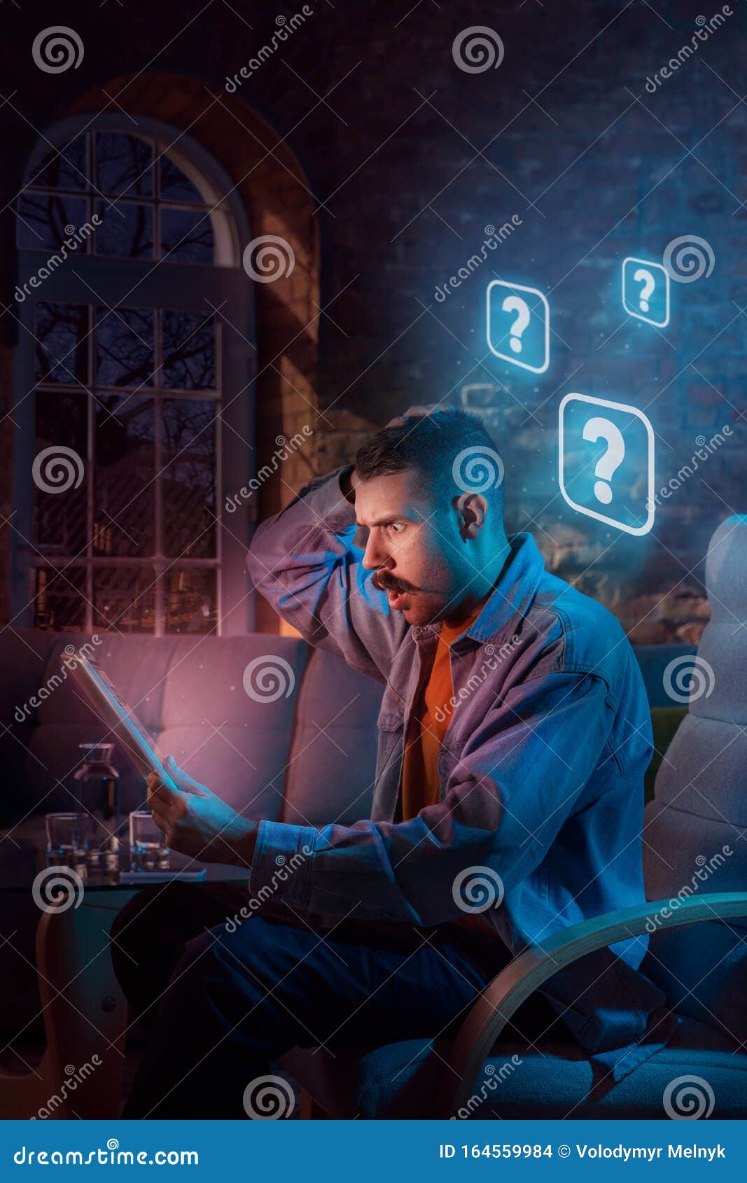 Man Using Gadget and Receive Neon Notifications at Home at Night Stock ...