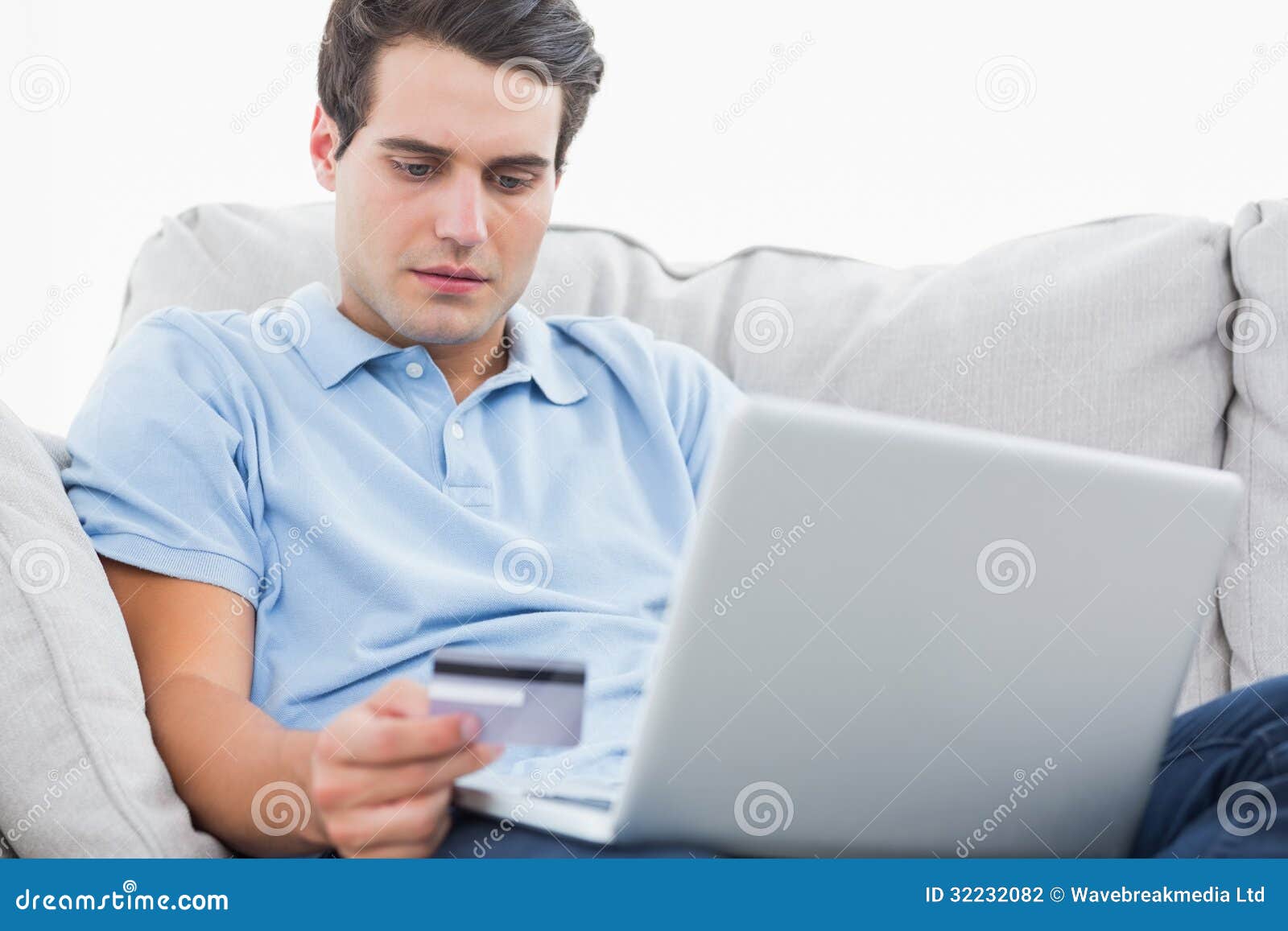 Man Using His Credit Card To Purchase Online Stock Photo - Image of ...