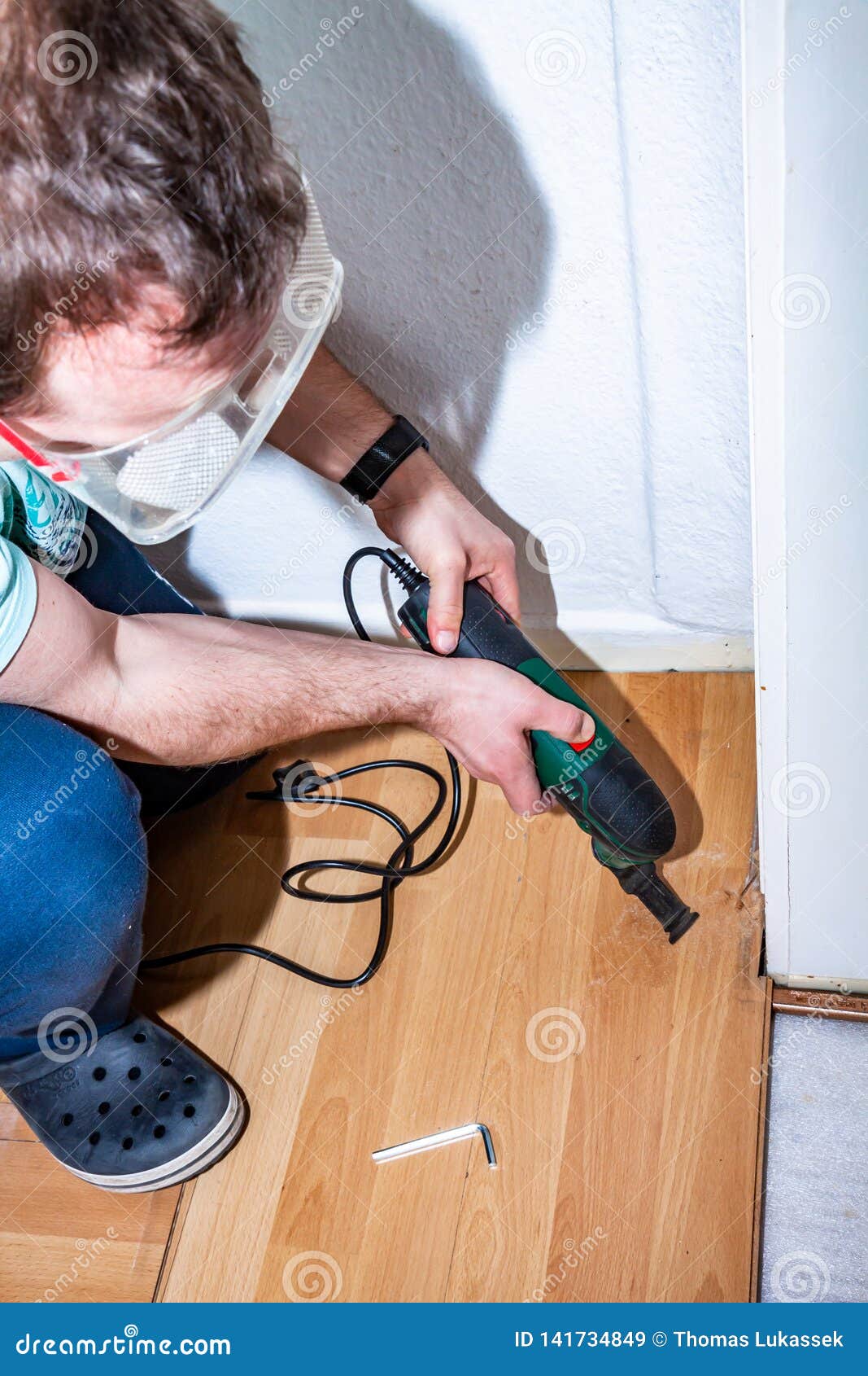 Man Using His Electric Multi Tool on Laminate Stock Image - Image of ...