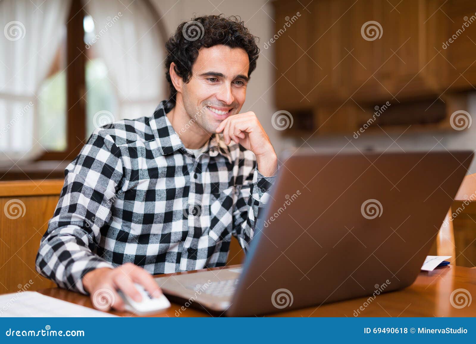 Man Using His Laptop at Home Stock Photo - Image of house, notebook ...