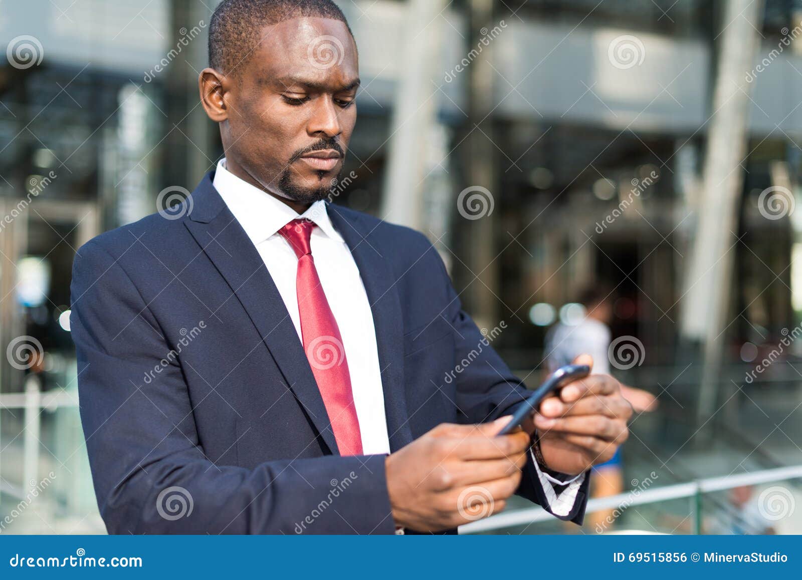 Man using his mobile phone stock photo. Image of application - 69515856