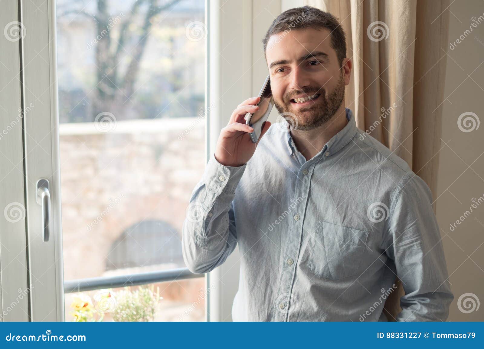 Man Using His Mobile Phone at Home Stock Image - Image of privacy, cell ...