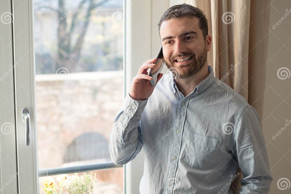 Man Using His Mobile Phone at Home Stock Image - Image of privacy, cell ...