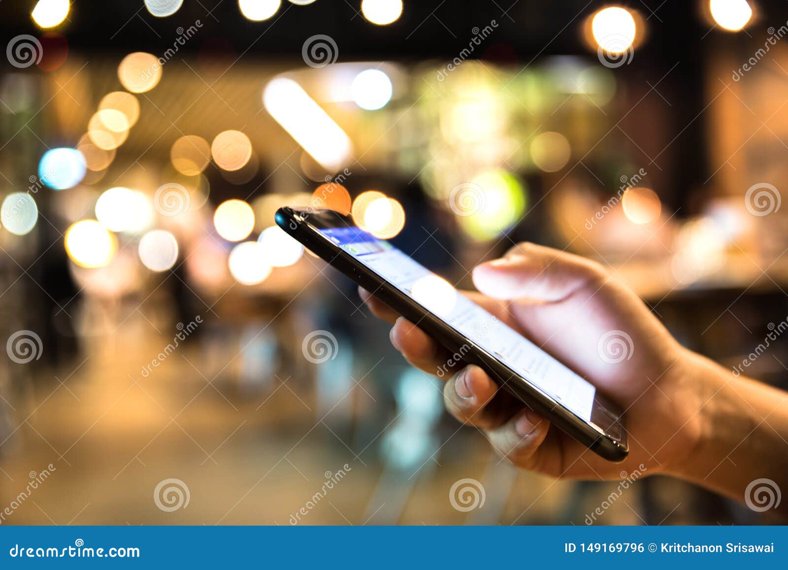 Man Using His Mobile Phone in the Pub or Restaurant. Stock Photo ...