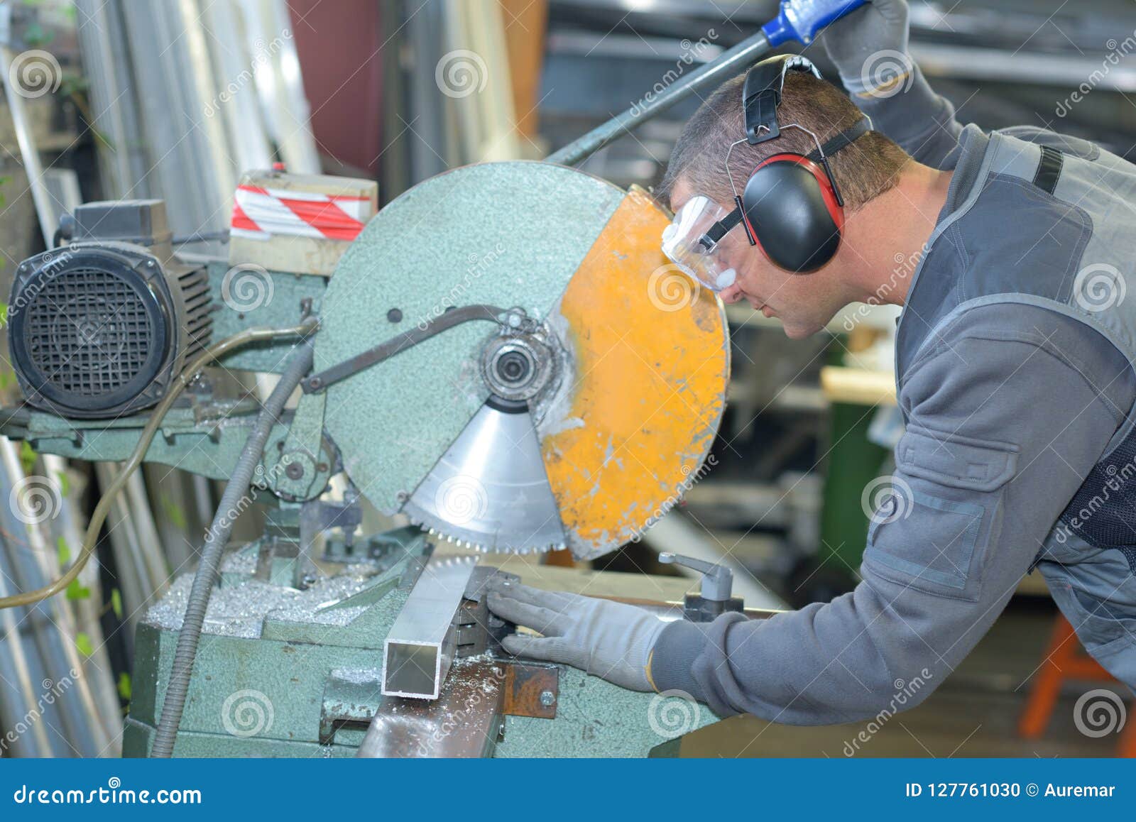 Man Using Industrial Circular Saw Stock Photo - Image of tooth, yellow ...