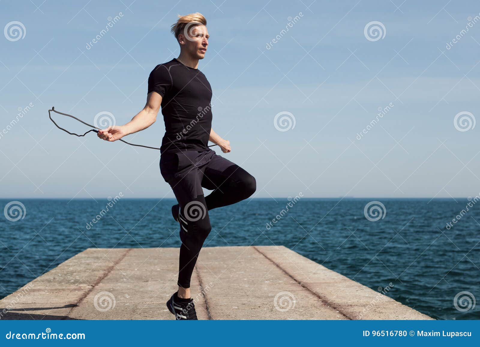 Man Using Jumping Rope Standing on Pier Stock Photo - Image of clear ...