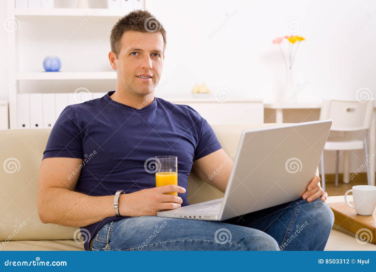 Man using laptop stock photo. Image of couch, looking - 8503312