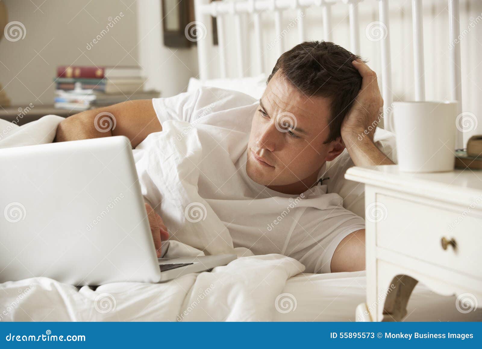 Man Using Laptop in Bed at Home Stock Image - Image of internet, movie ...