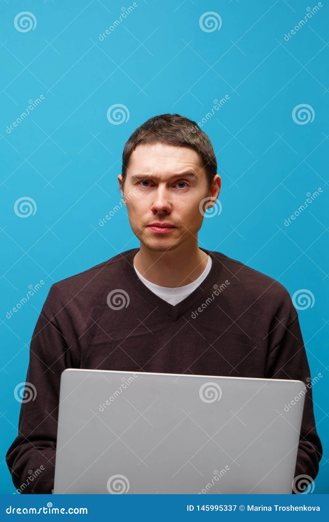 Man is Using a Laptop on Blue Background. Stock Image - Image of ...
