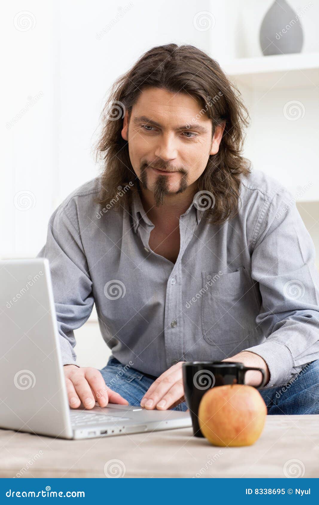 Man using laptop computer stock image. Image of apartment - 8338695
