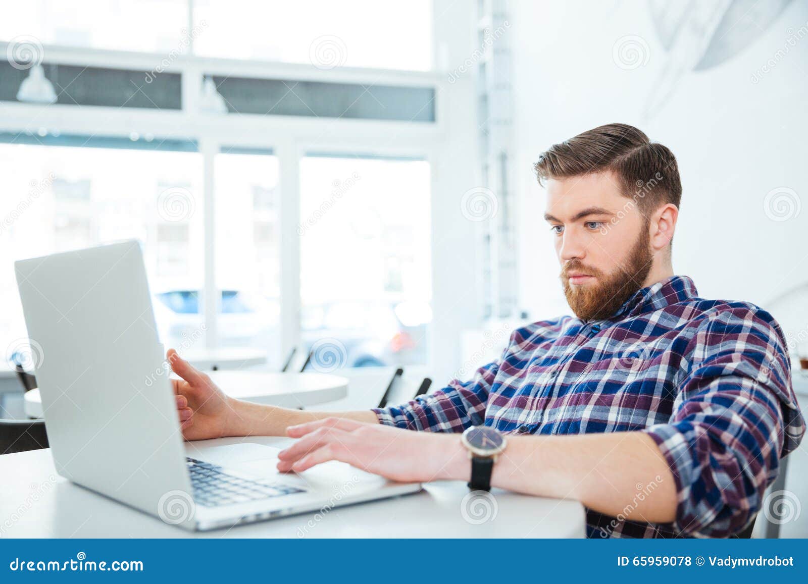 Man Using Laptop Computer in Coffee Shop Stock Photo - Image of counter ...