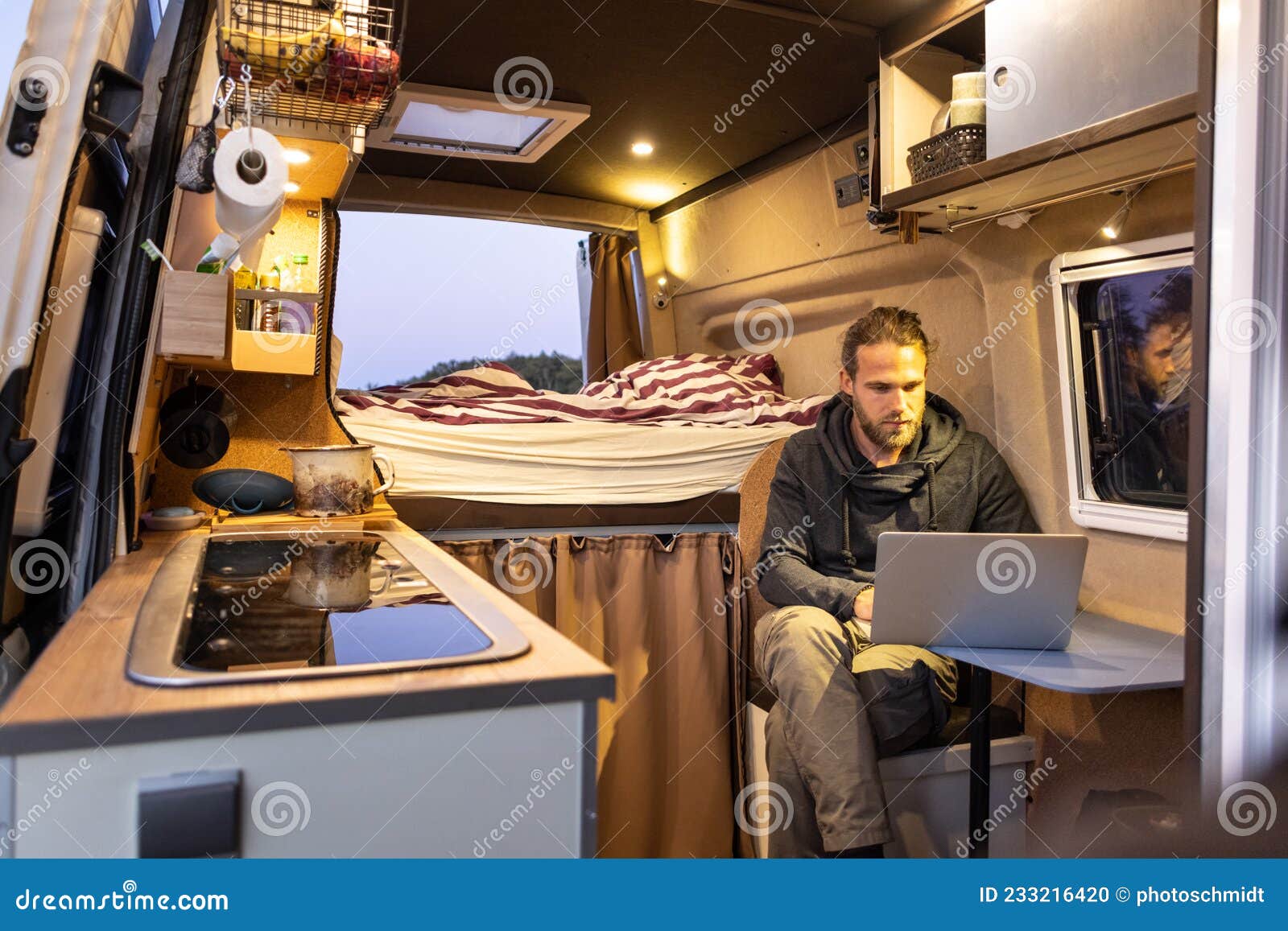 Man Using a Laptop Computer Inside His Camper Van Stock Photo - Image ...