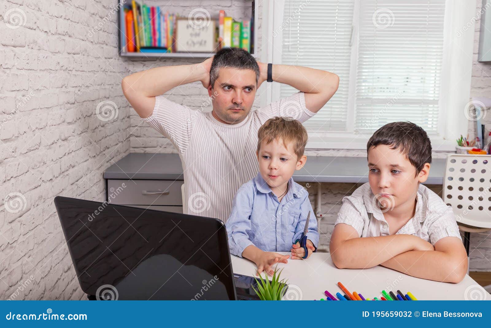Man Using Laptop Computer Working at Home. Stressed Dad Trying To Work ...
