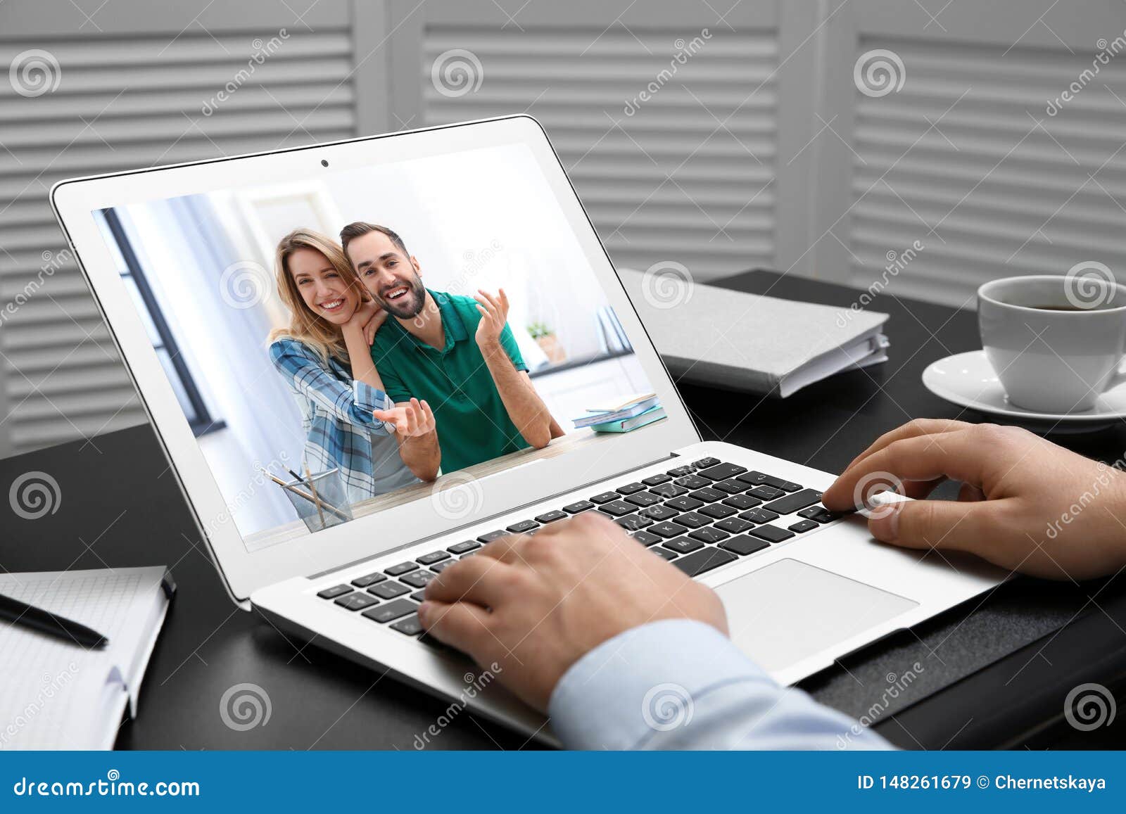 Man Using Laptop for Conversation Via Video Chat at Table Stock Image ...