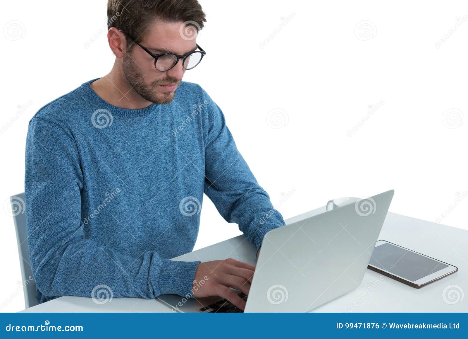 Man using laptop at desk stock photo. Image of casual - 99471876