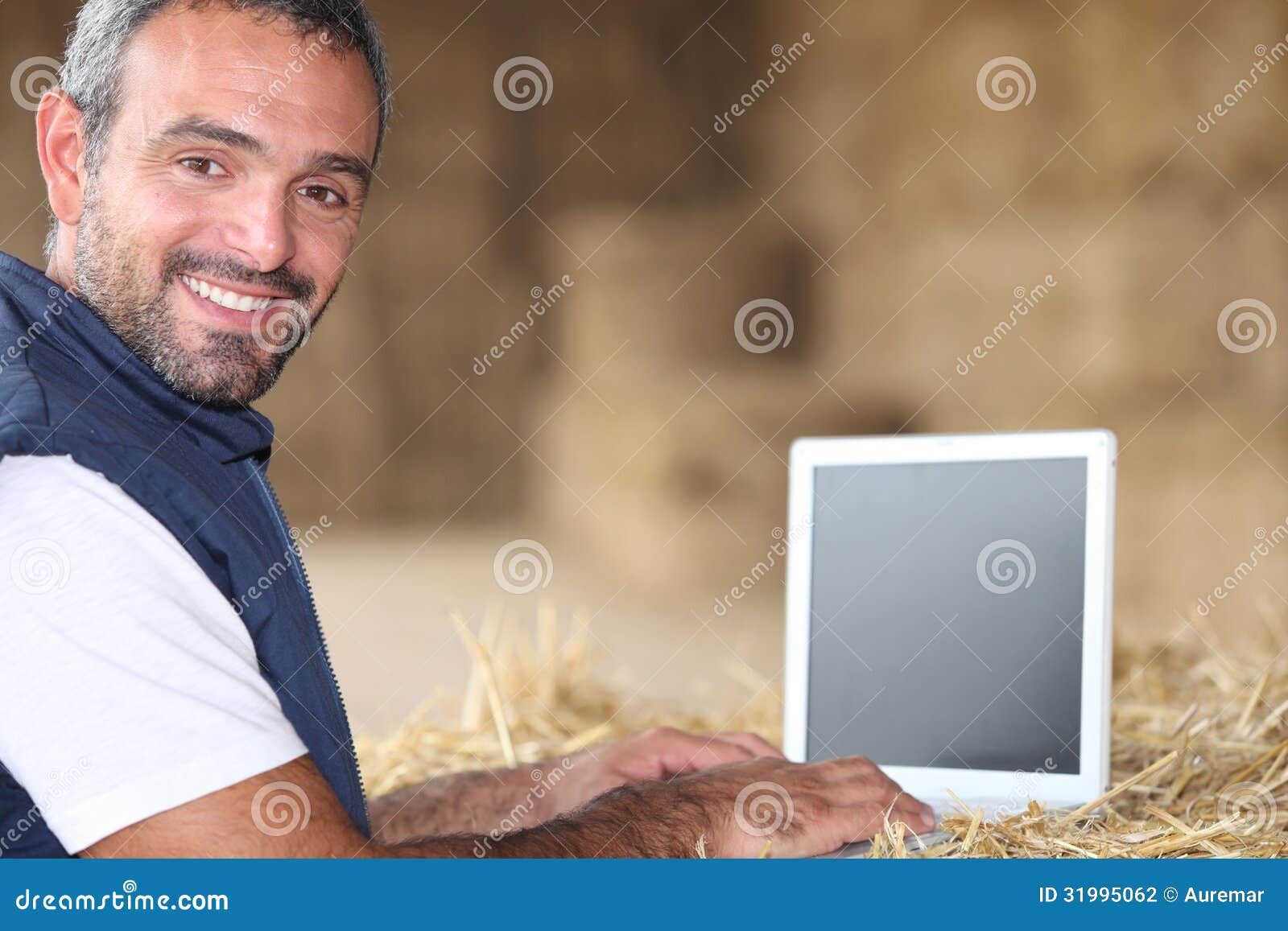 Man using laptop on a farm stock photo. Image of management - 31995062
