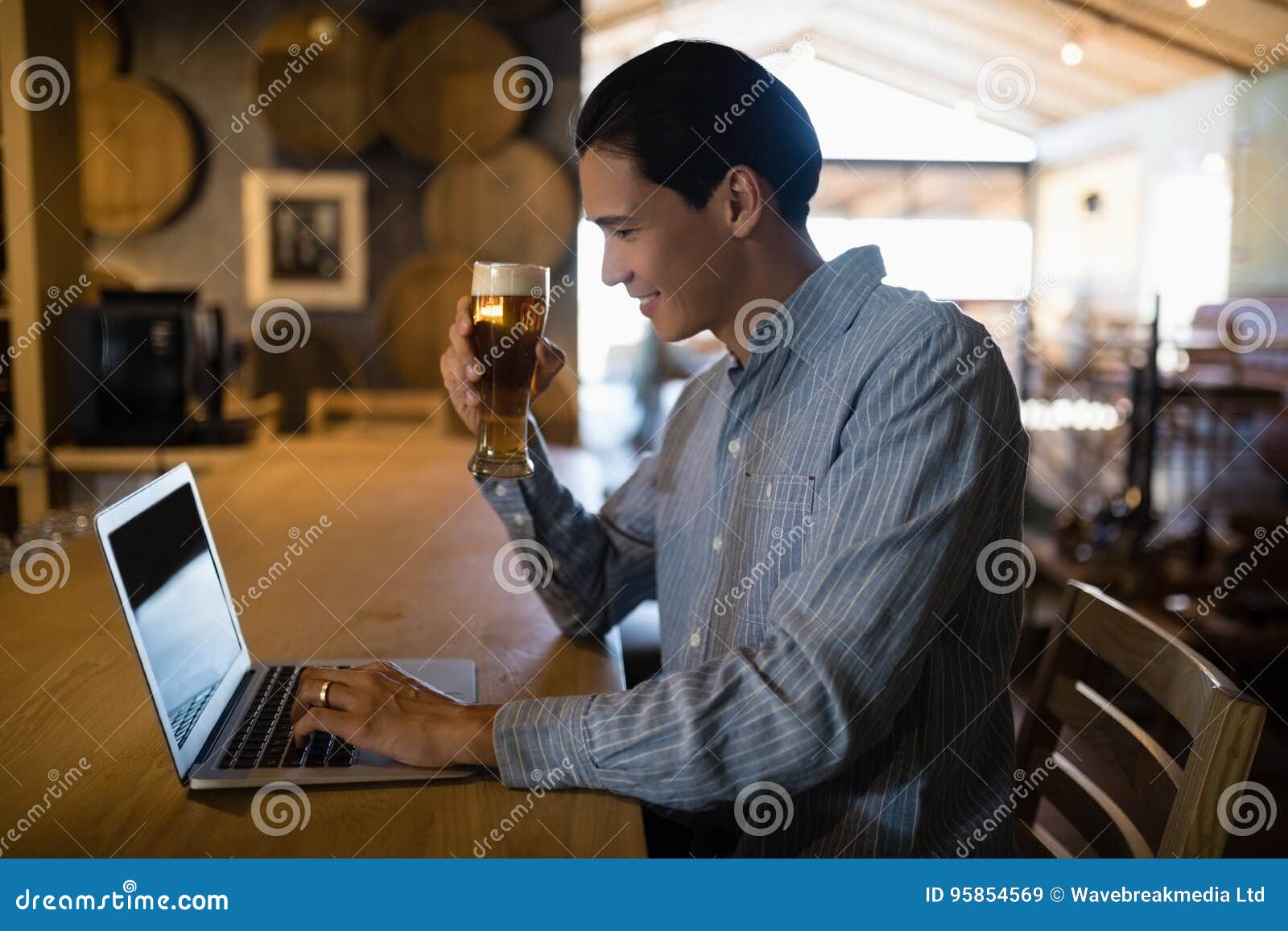 Man Using Laptop while Having Beer Stock Image - Image of global, food ...