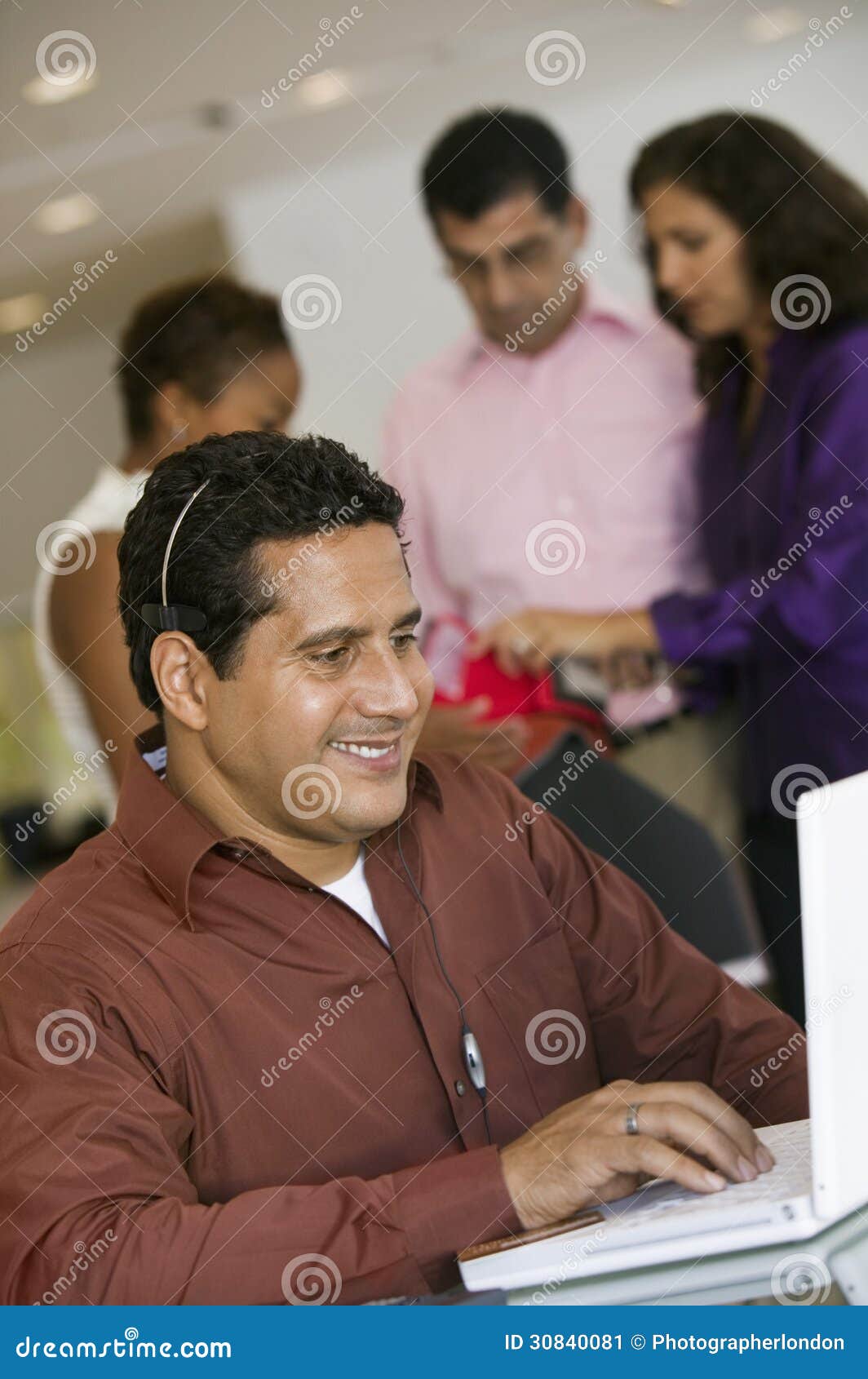 Man Using Laptop with Headset in Furniture Store Stock Image - Image of ...