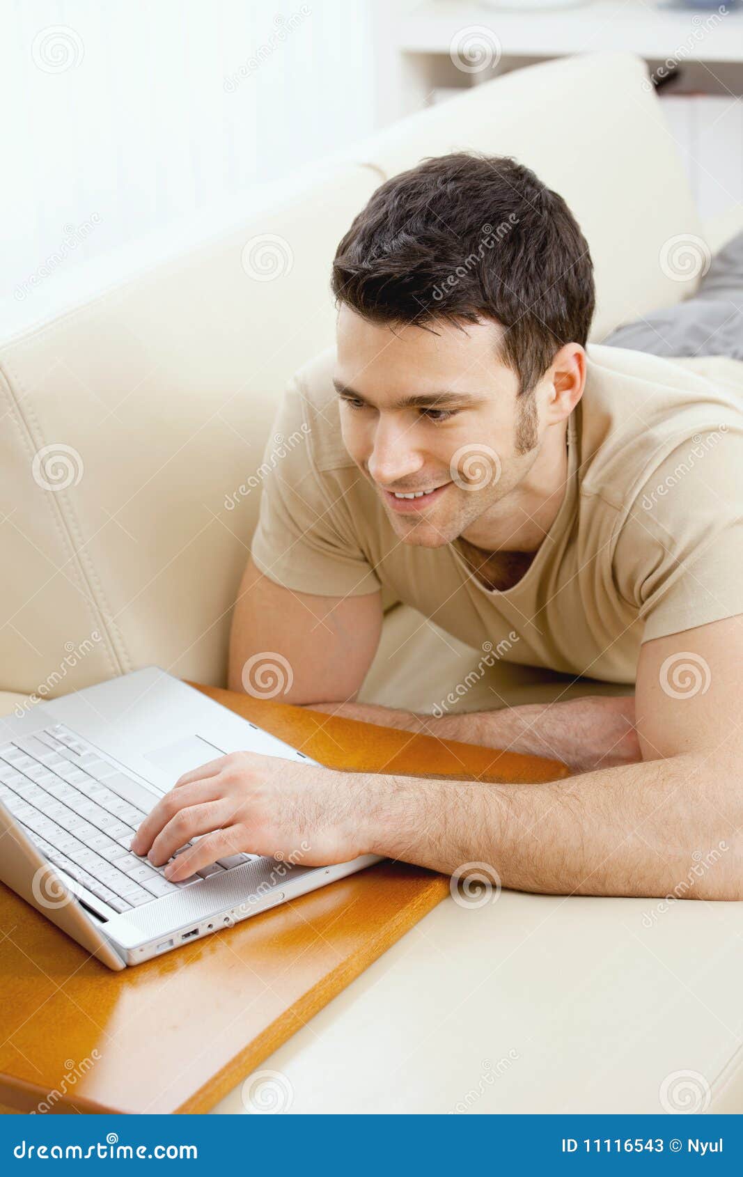 Man using laptop at home stock image. Image of comfort - 11116543