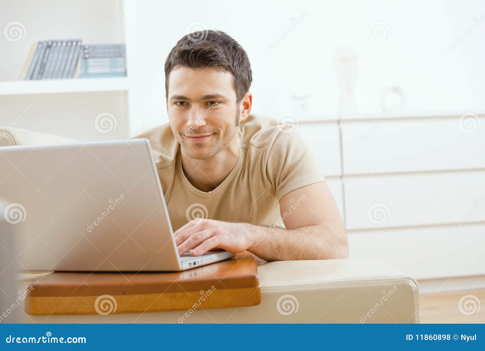 Man using laptop at home stock photo. Image of alone - 11860898