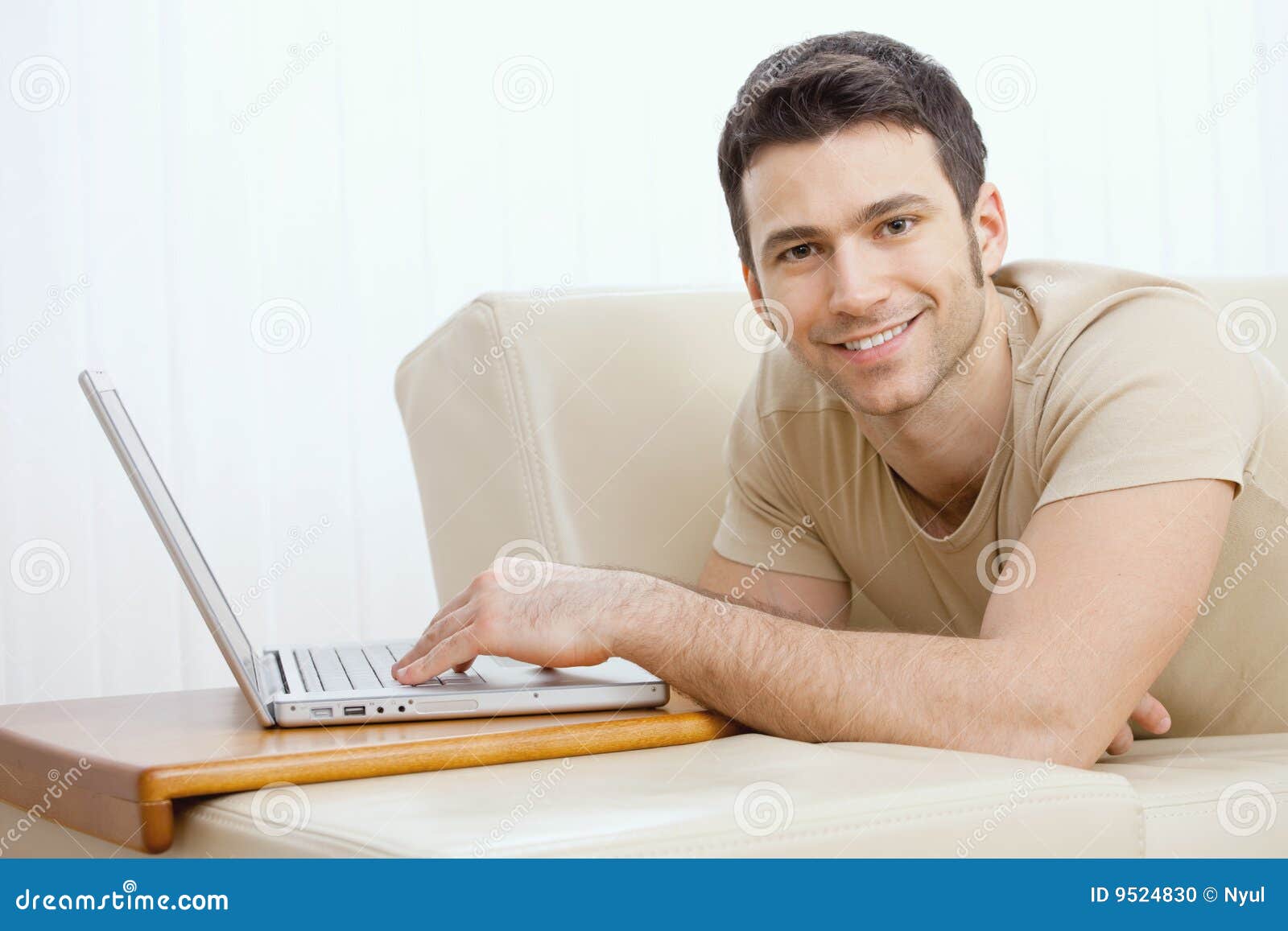 Man using laptop at home stock photo. Image of caucasian - 9524830