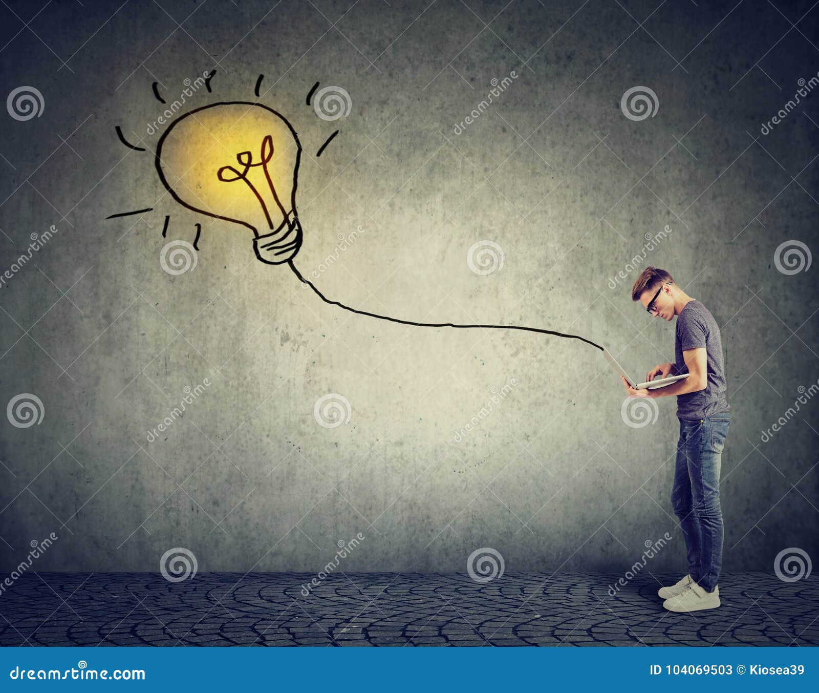 Man Using a Laptop with Light Bulb Plugged in it Stock Image - Image of ...