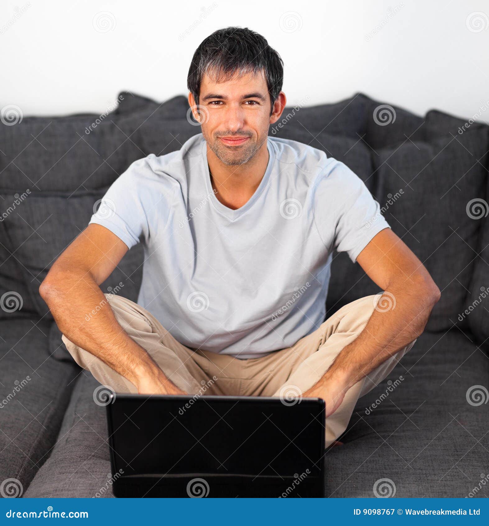 Man Using Laptop Looking at Camera Stock Image - Image of casual ...