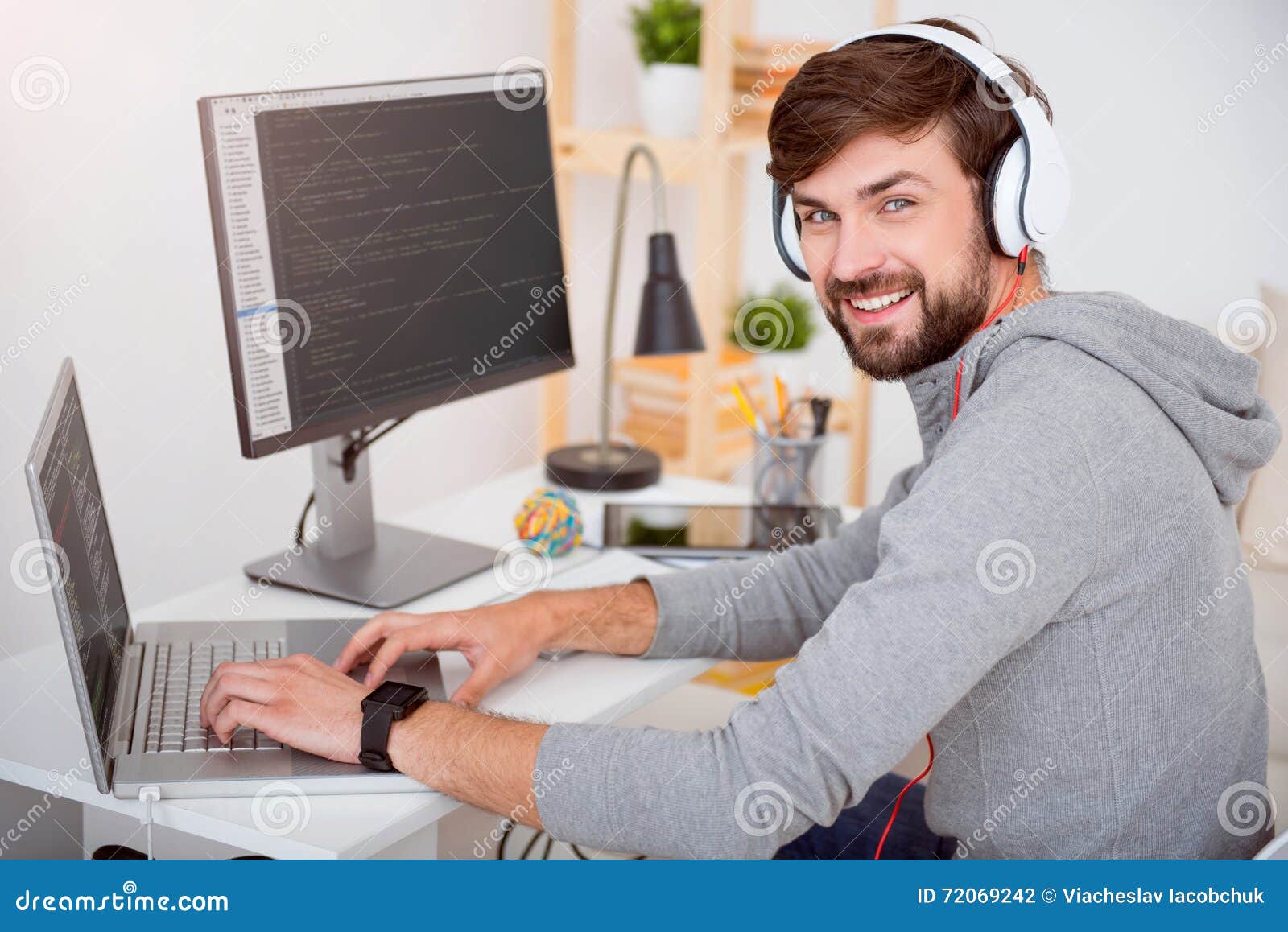 Man Using Laptop and Looking at Camera Stock Photo - Image of coding ...