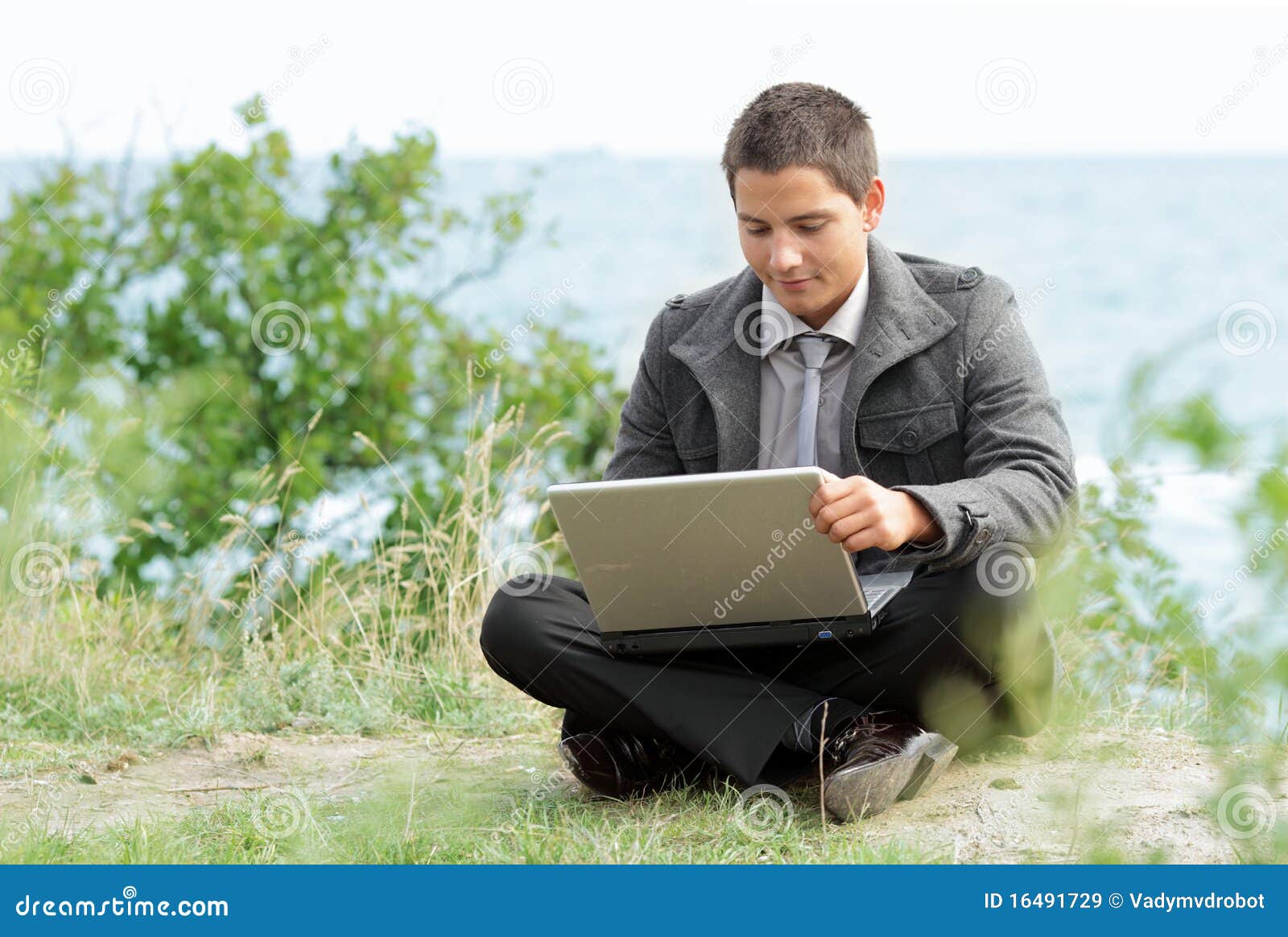 Man Using a Laptop Outdoors Stock Image - Image of mobile, active: 16491729