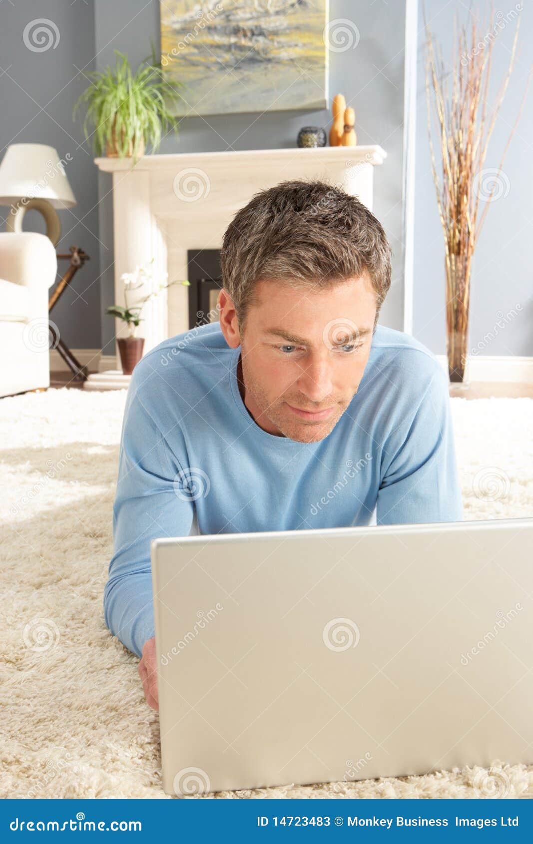 Man Using Laptop Relaxing Laying on Rug at Home Stock Image - Image of ...