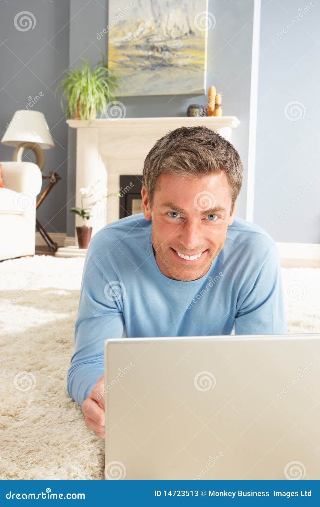 Man Using Laptop Relaxing Laying on Rug at Home Stock Image - Image of ...