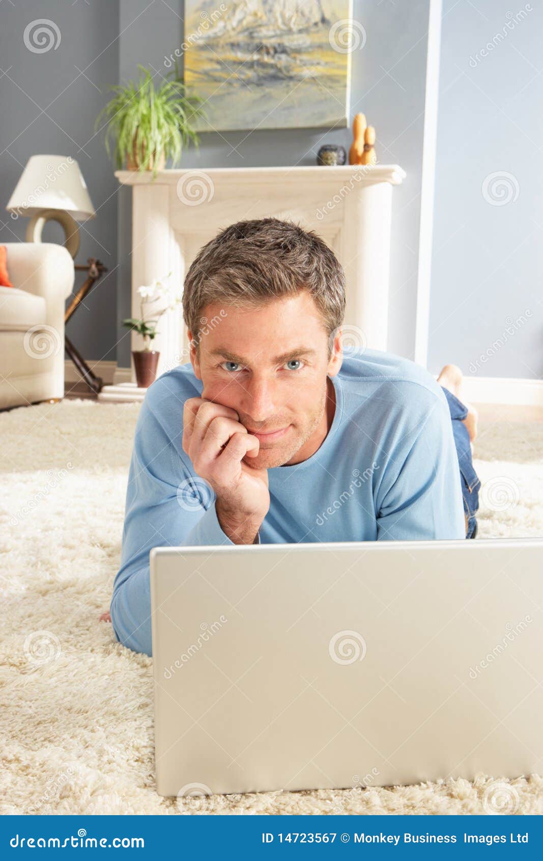 Man Using Laptop Relaxing Laying on Rug at Home Stock Image - Image of ...