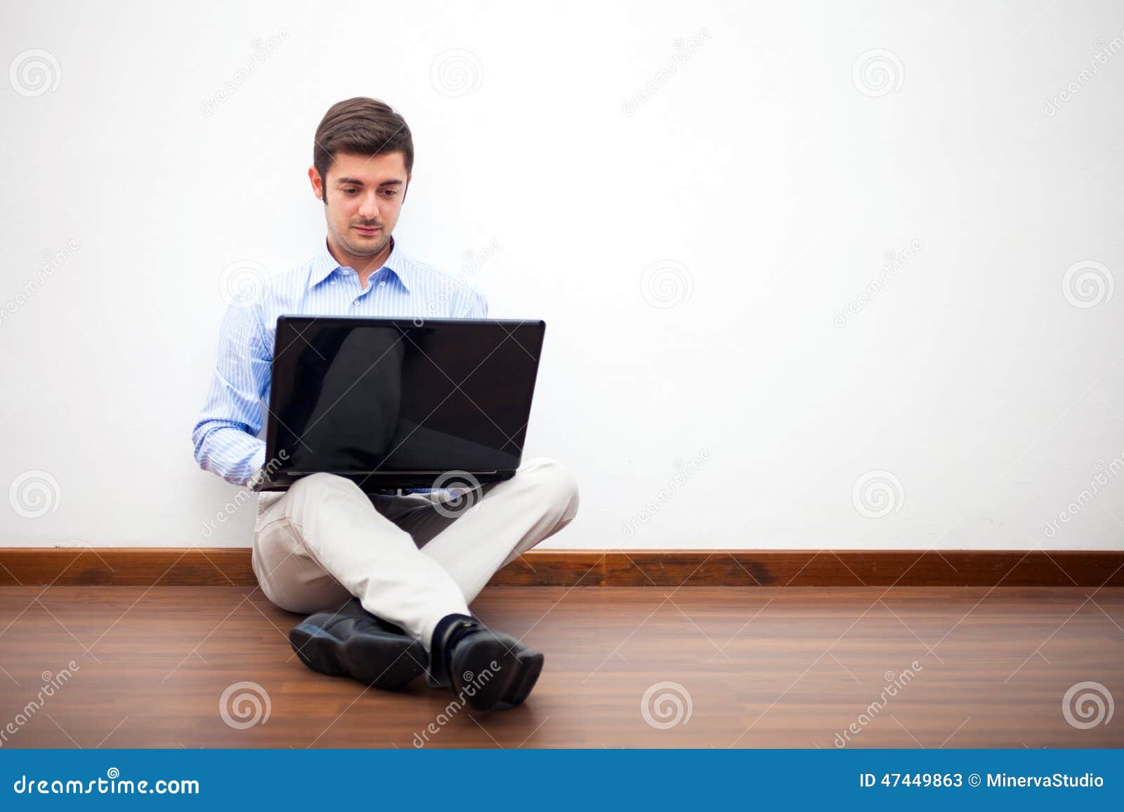 Man Using a Laptop while Sitting on the Floor Stock Image - Image of ...