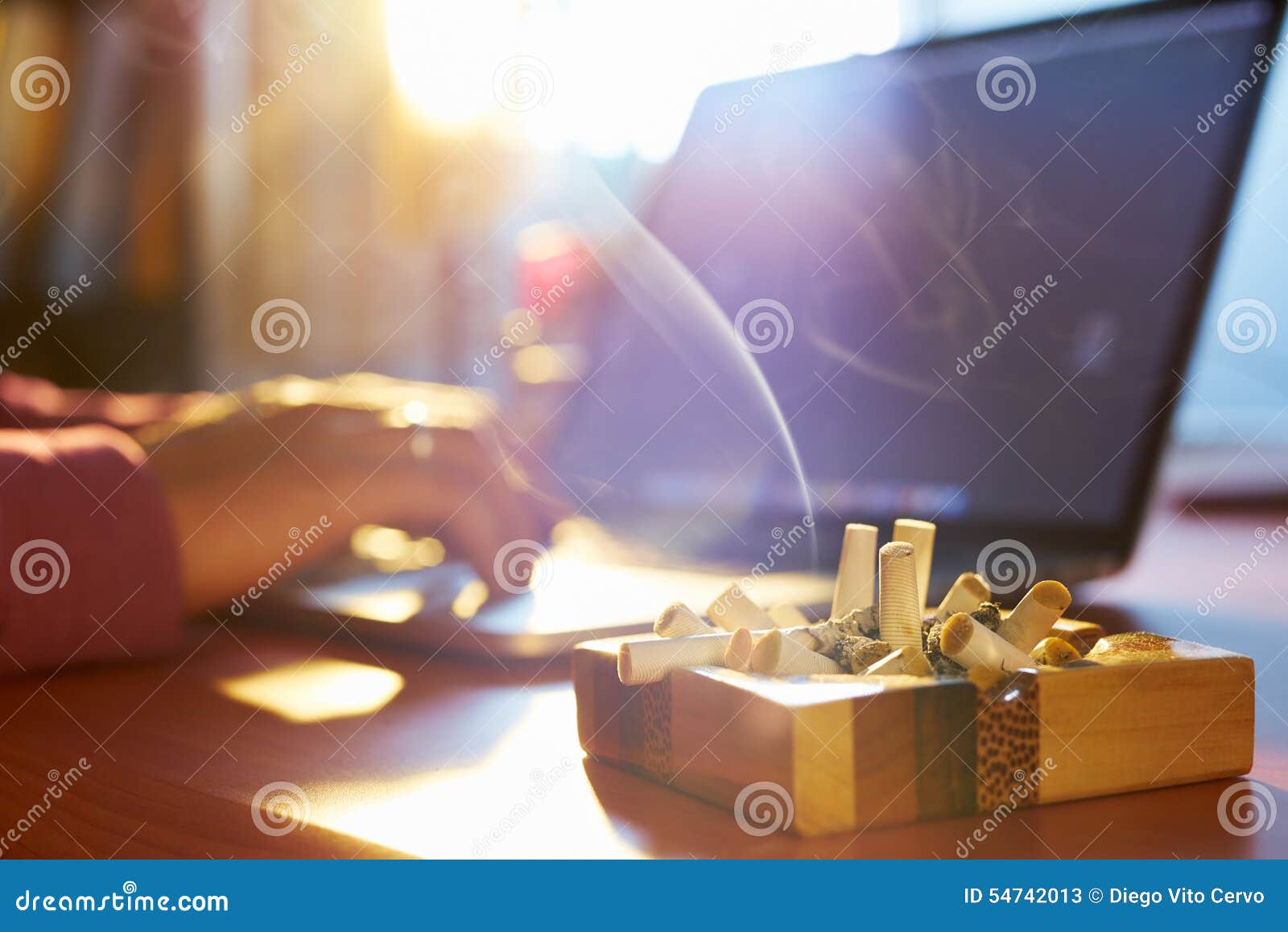 Man Using Laptop and Smoking Cigarette in the Morning Stock Image ...
