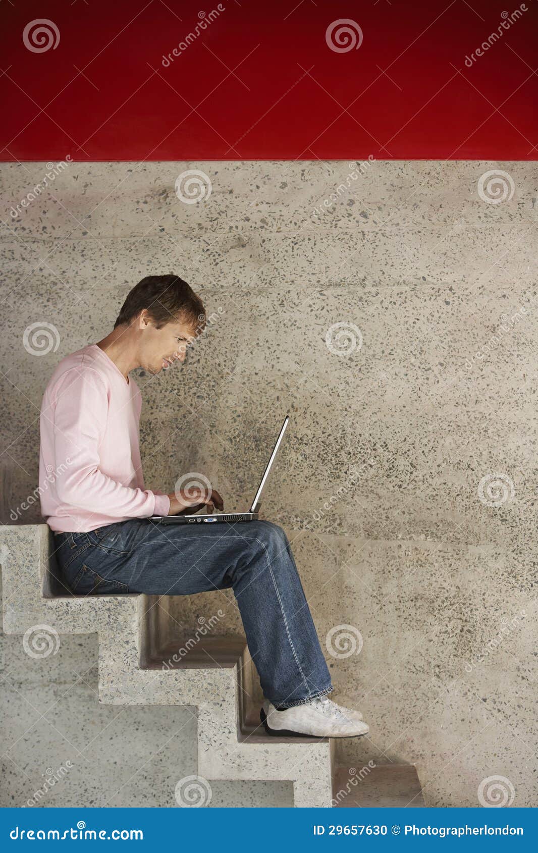 Man Using Laptop on Stairs stock photo. Image of browsing - 29657630