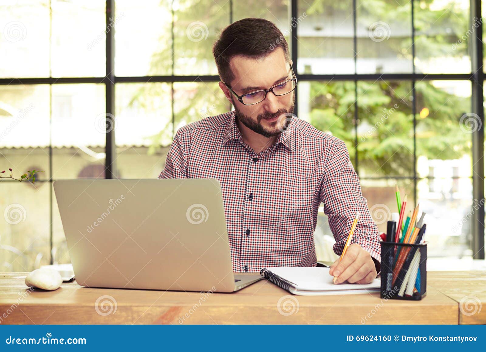 Man Using Laptop and Taking Notes Stock Photo - Image of occupation ...
