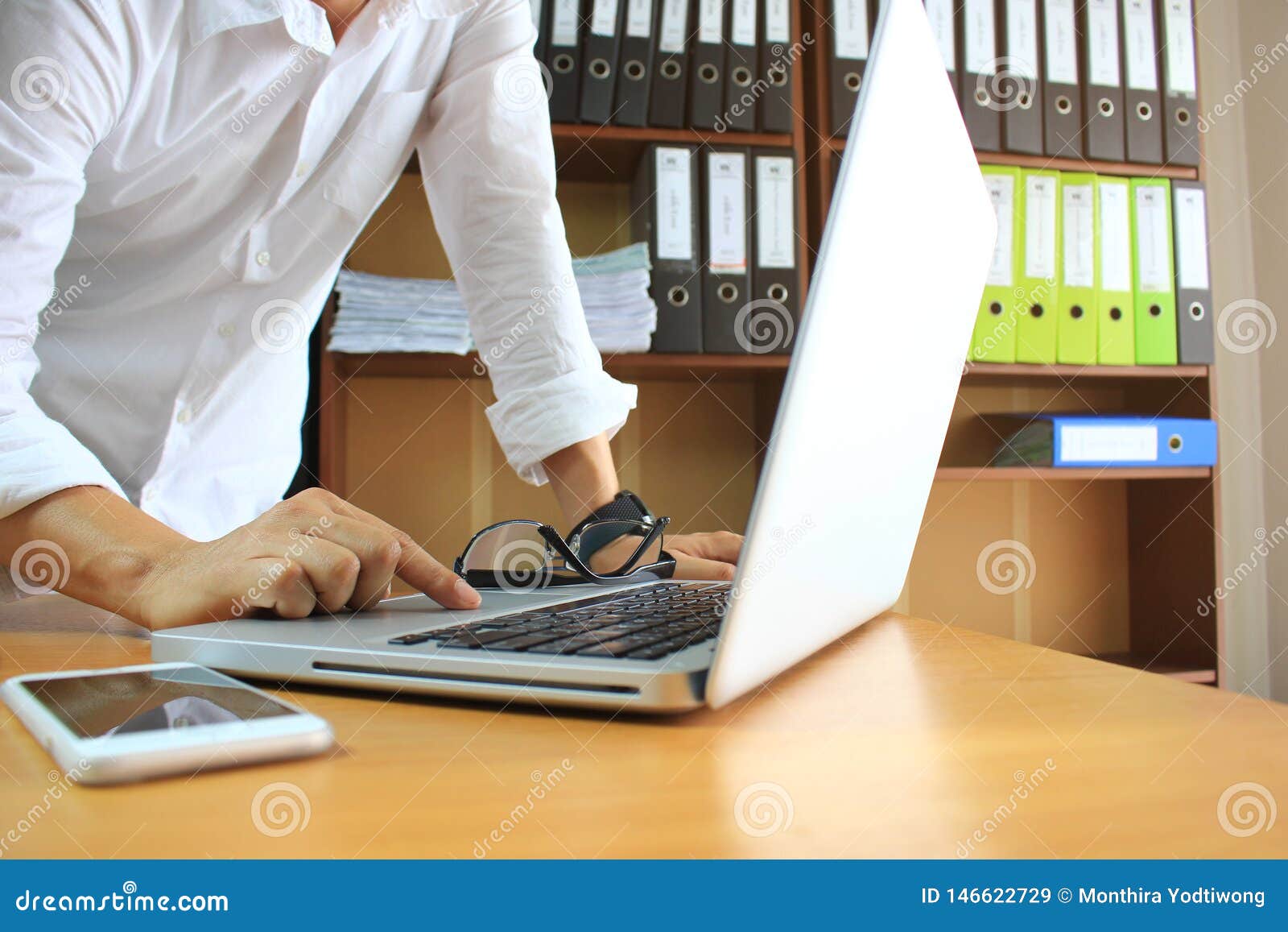 Man Using Laptop and Working on the Table in Office Stock Image - Image ...