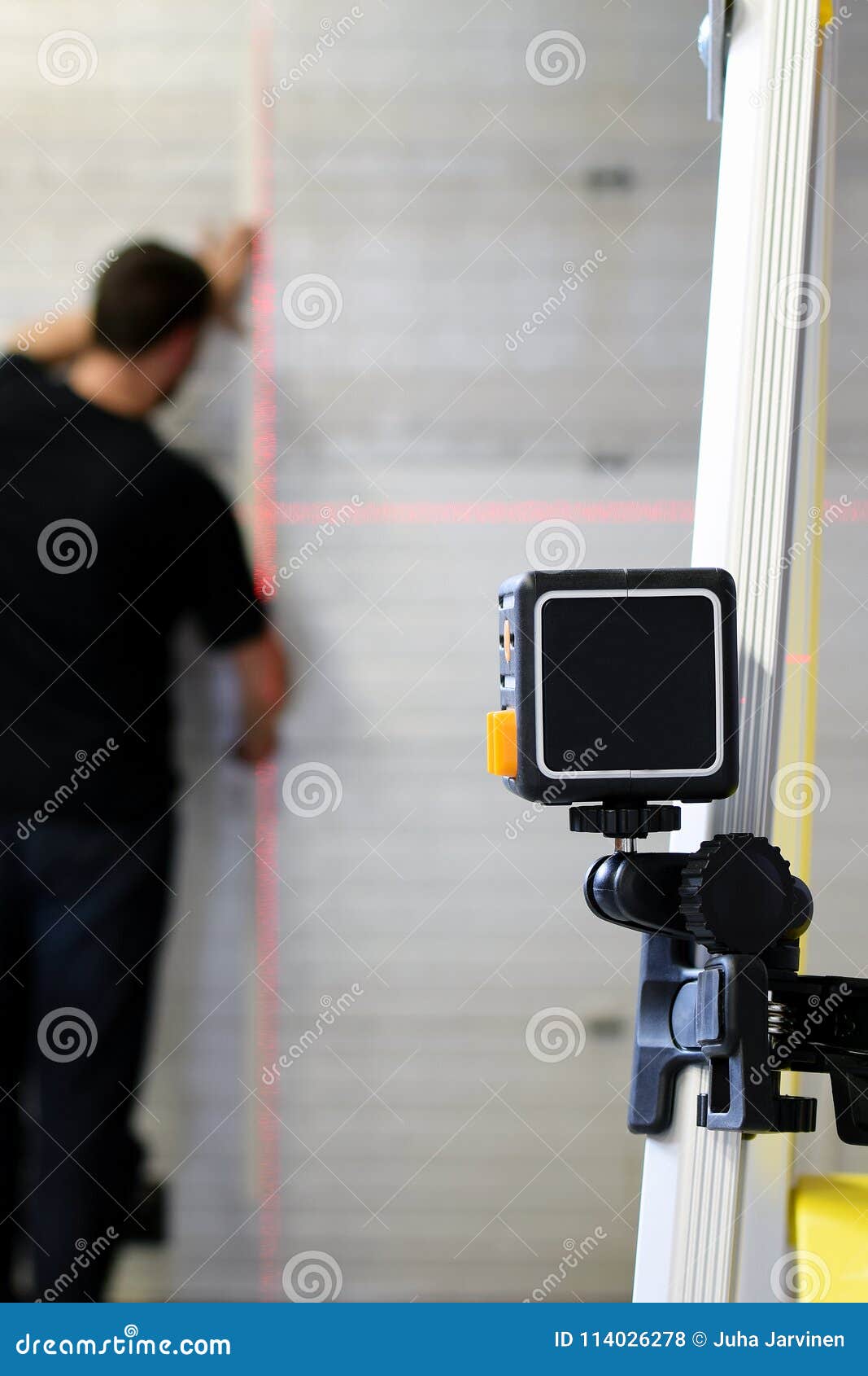 Man Using Laser Level Measuring Tool in Construction Work Stock Photo ...