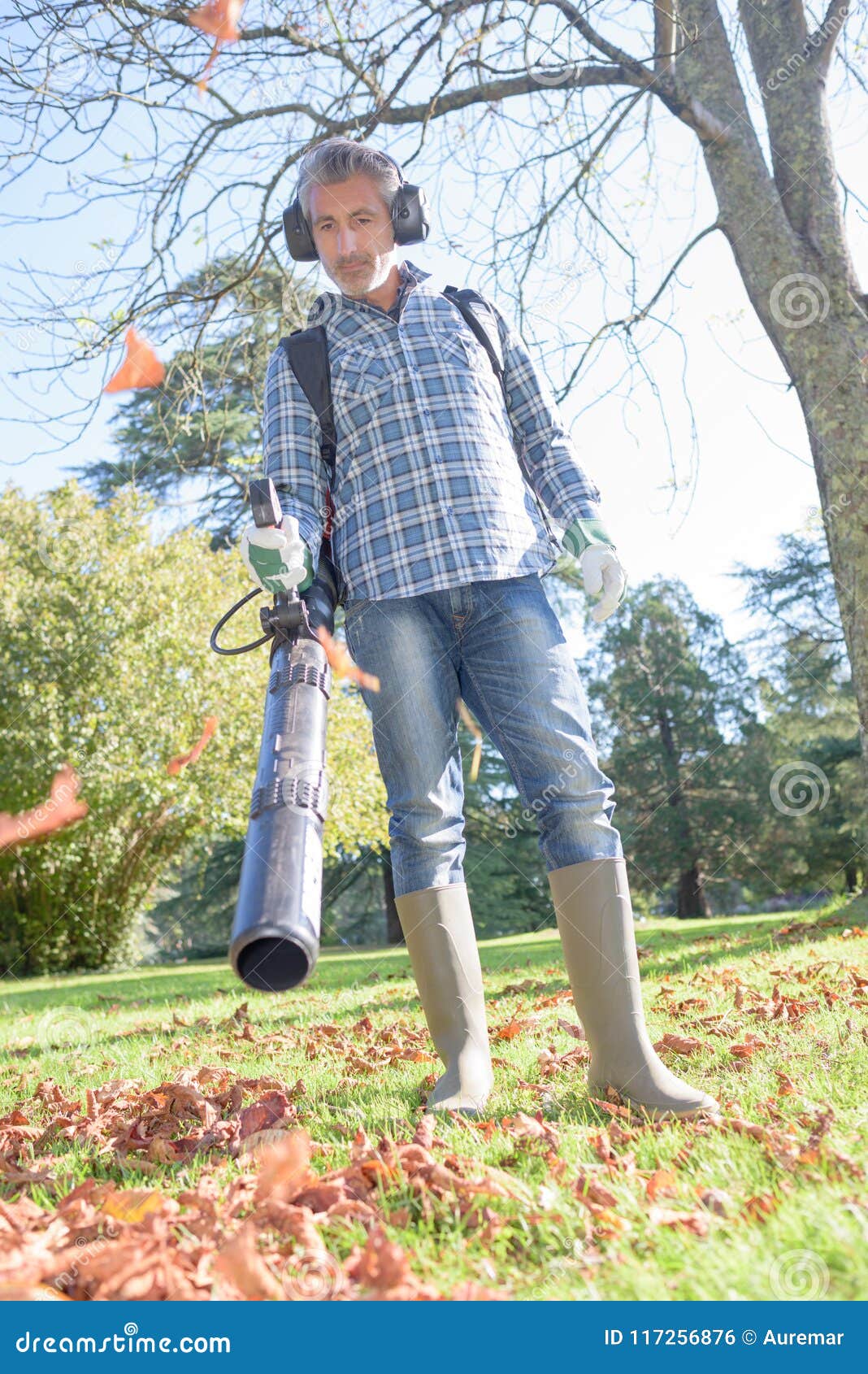 Man using leaf blower stock photo. Image of green, turf - 117256876