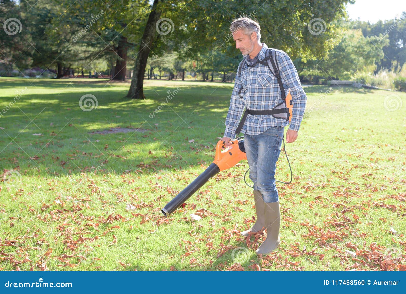 Man using leaf blower stock photo. Image of senior, outdoors - 117488560