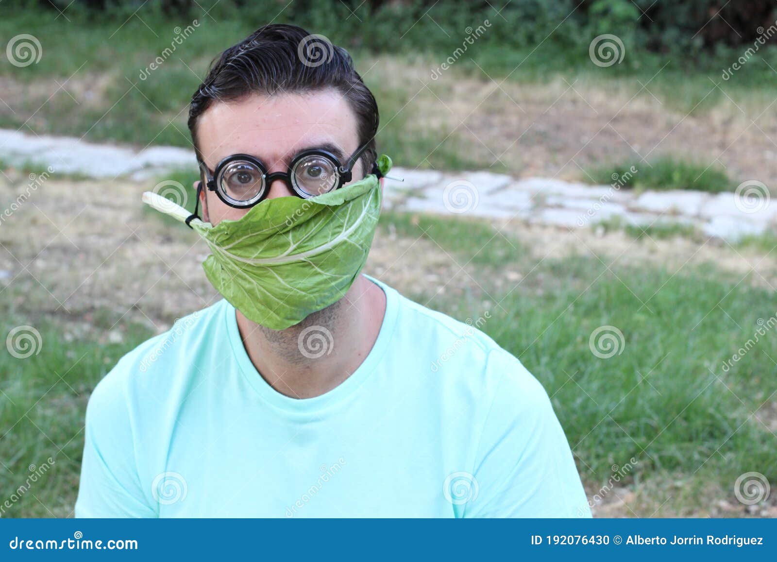 Man Using Lettuce As Protective Face Mask Stock Photo - Image of fresh ...