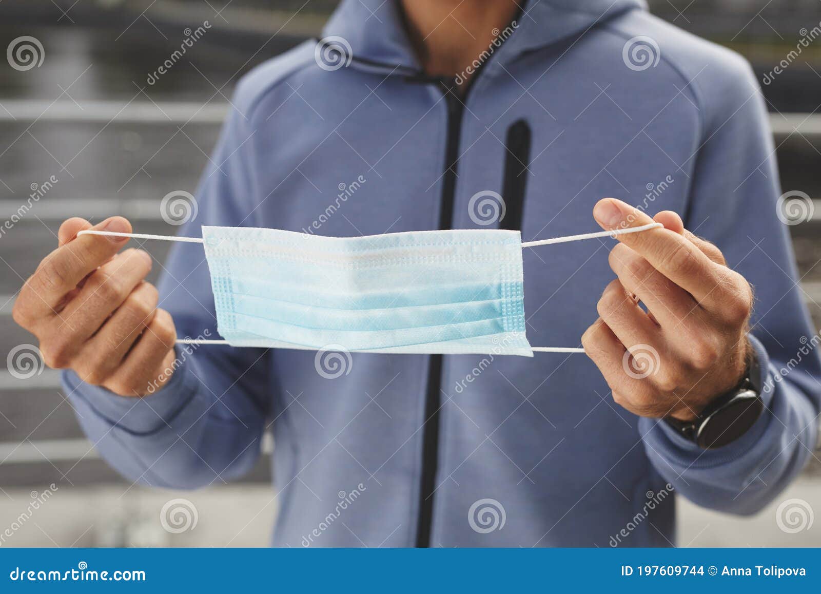 Man using mask outdoors stock photo. Image of protection - 197609744