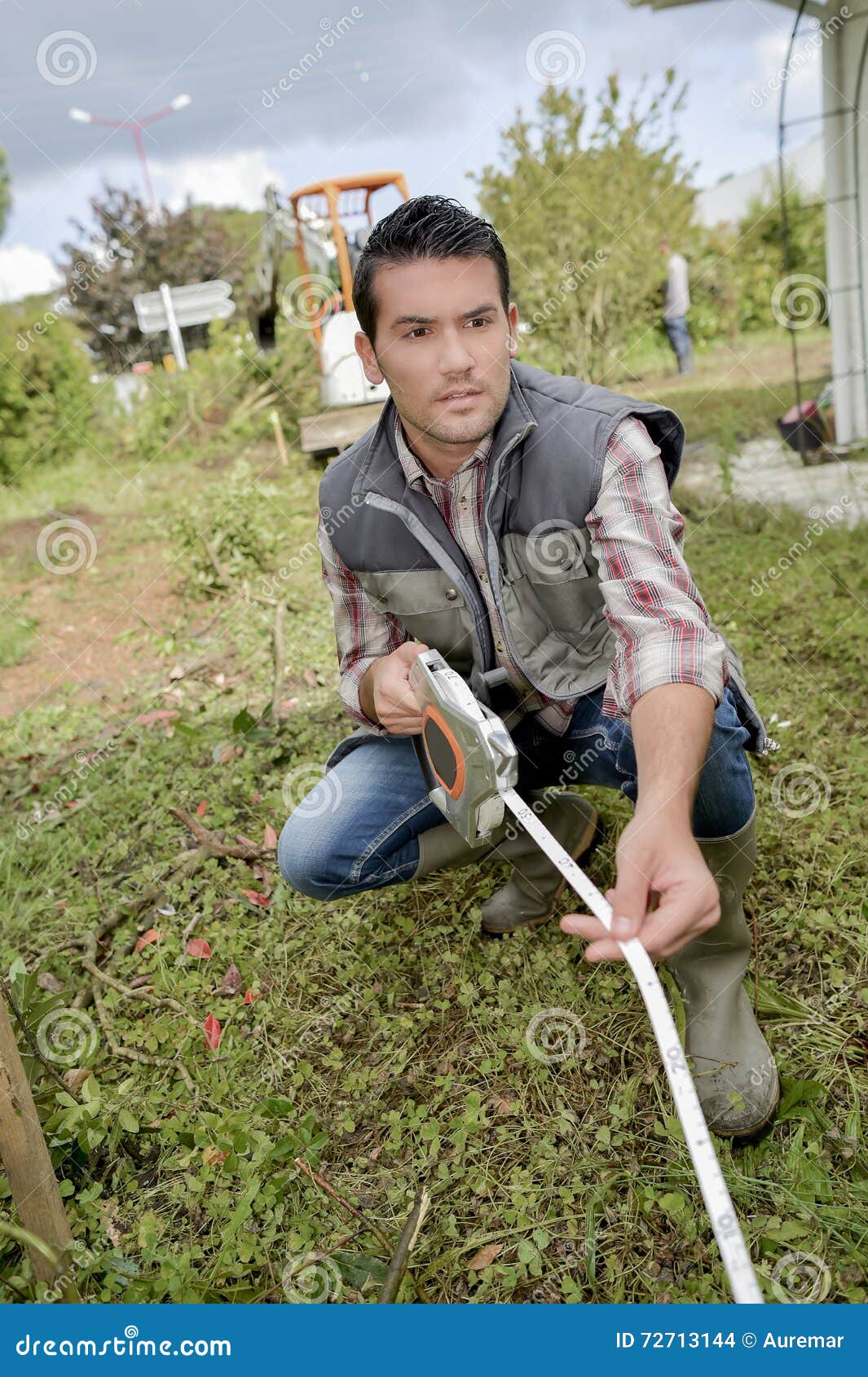 Man Using a Measuring Tape in the Garden Stock Photo - Image of nature ...