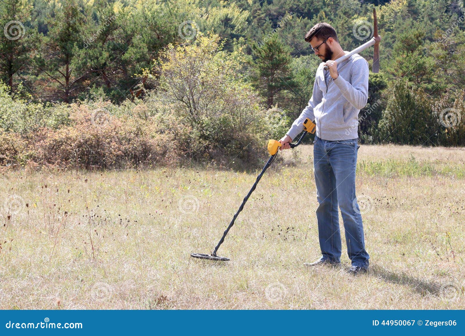 Man using a metal detector stock image. Image of lawn - 44950067