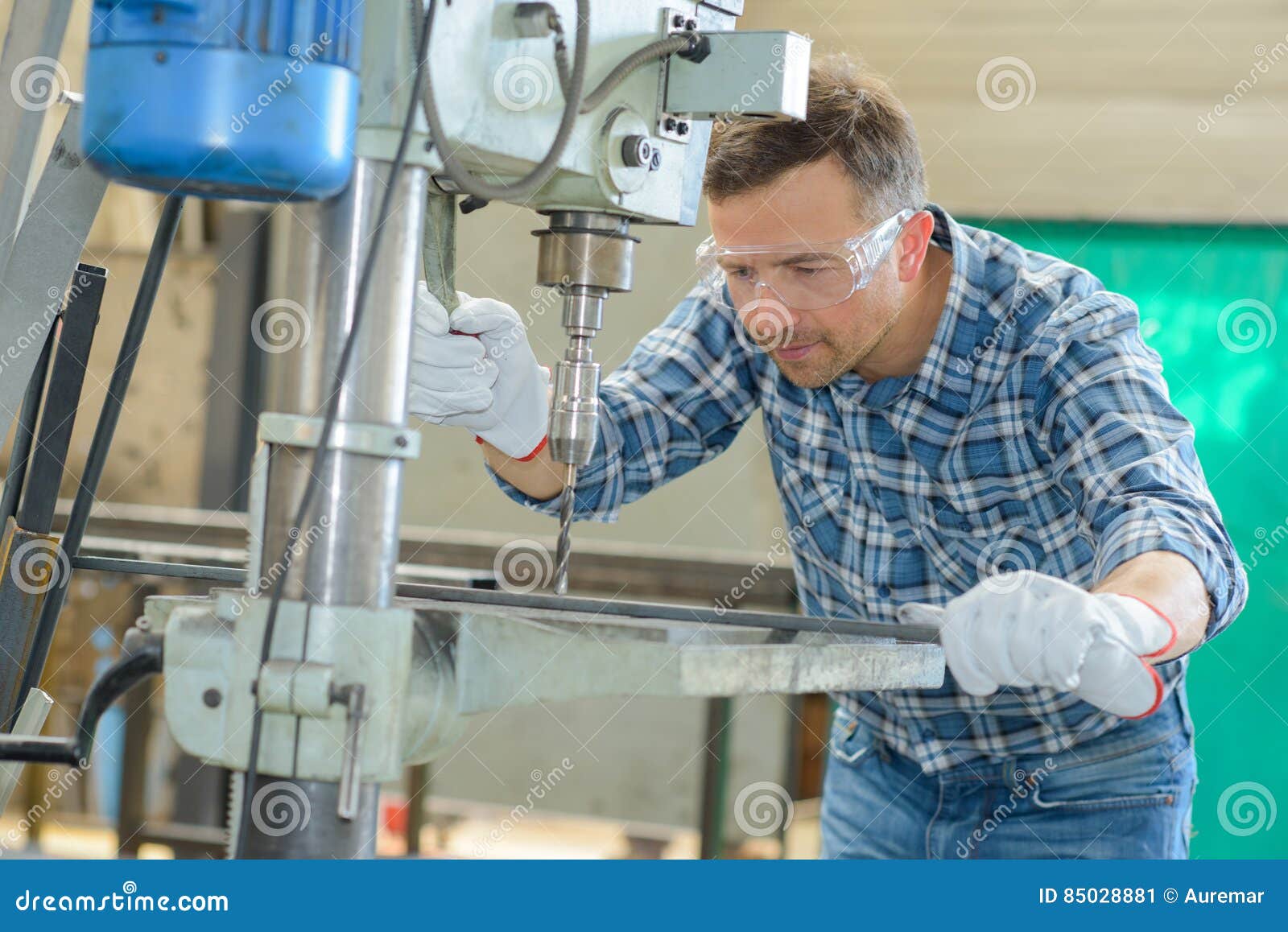 Man using metal driller stock image. Image of middle - 85028881