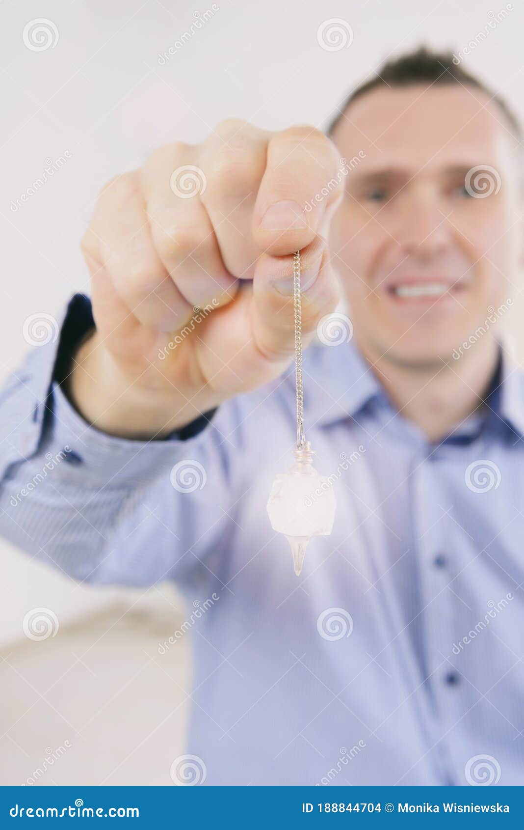 Man using metal pendulum stock photo. Image of hypnotising - 188844704