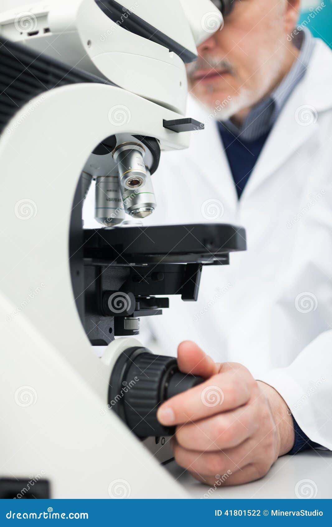 Man Using a Microscope in a Laboratory Stock Photo - Image of ...
